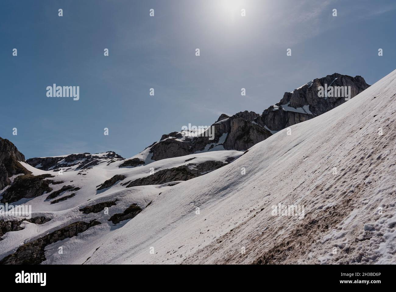 Hiker climbing steep slope hi-res stock photography and images - Alamy