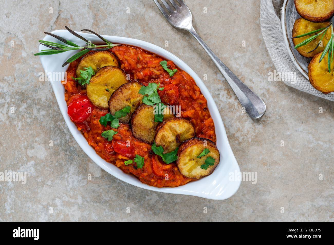 Jollof rice with deep fried plantain - spicy vegetarian African rice ...