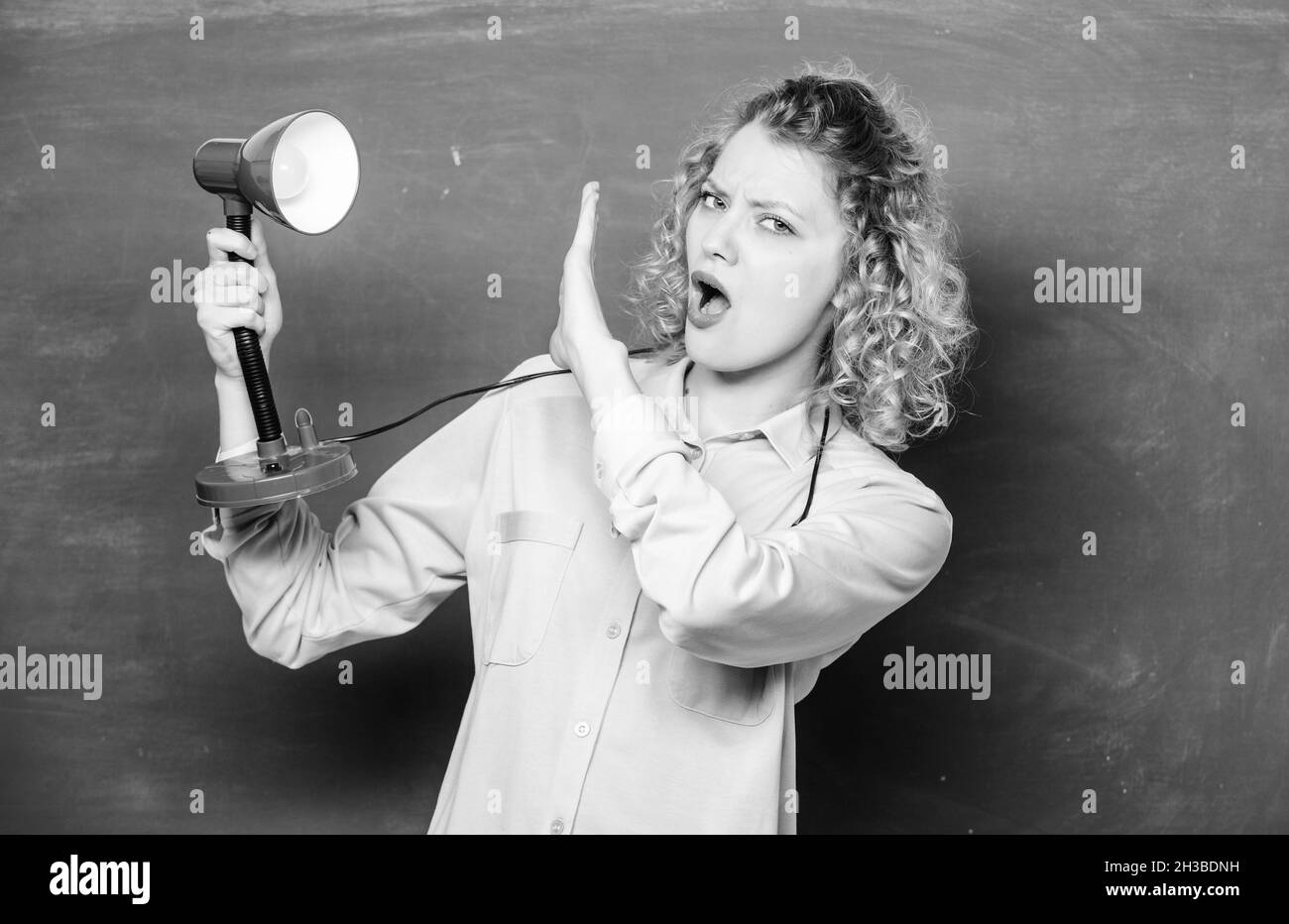 ray of light. education concept. back to school. teacher with lamp at ...