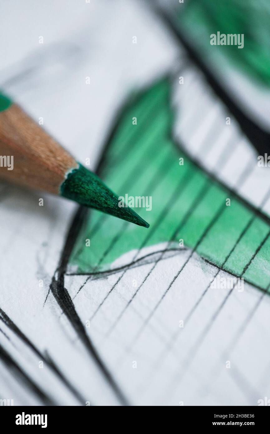 Desk drawing with green pencil Stock Photo - Alamy