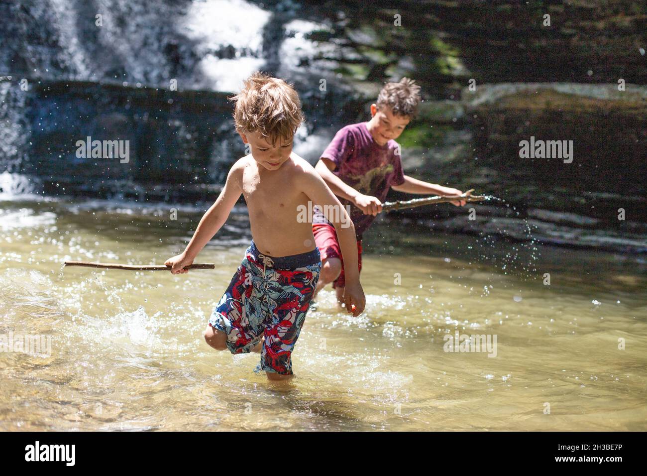 Playing in waterfall hi-res stock photography and images - Alamy