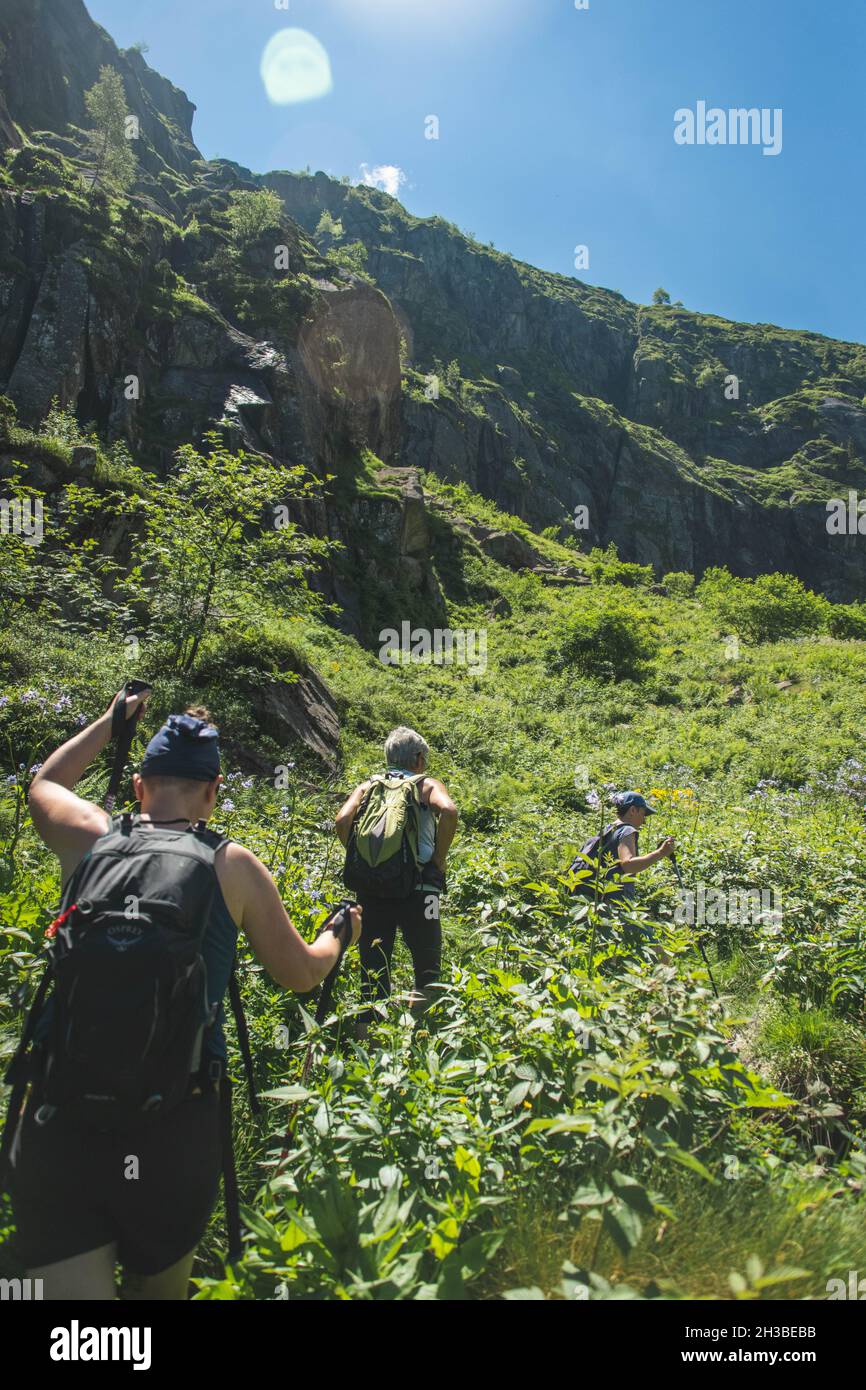 Hikers cross a mountain landscape in the Pyrenees Stock Photo - Alamy