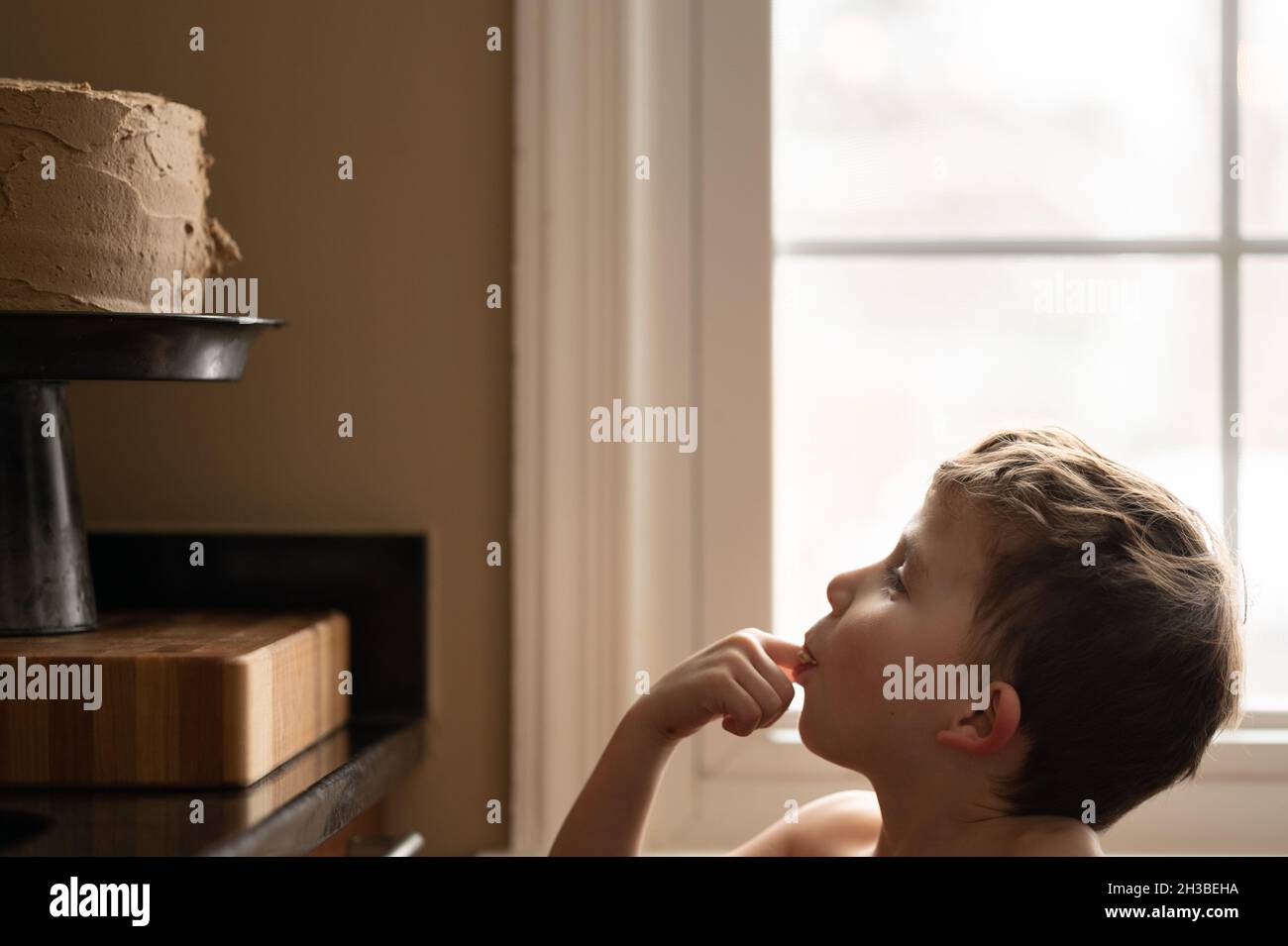 Boy sneaking hi-res stock photography and images - Alamy