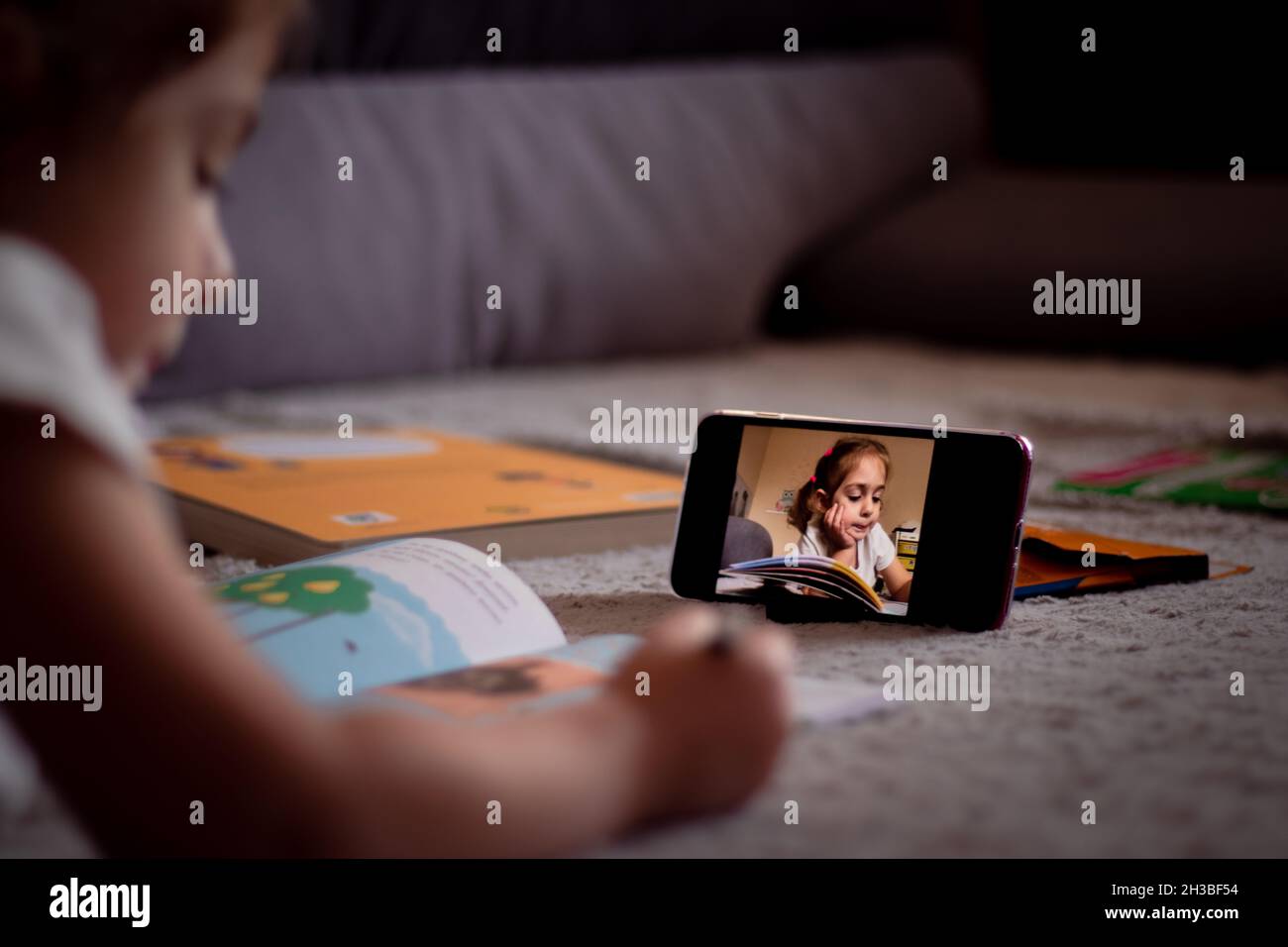 young girl is drawing with phone Stock Photo - Alamy