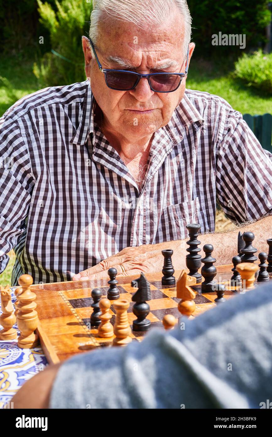 Grandfather boy playing game chess hi-res stock photography and images ...