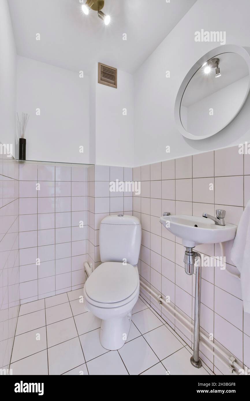 Interior of small clean restroom in miniature style Stock Photo - Alamy