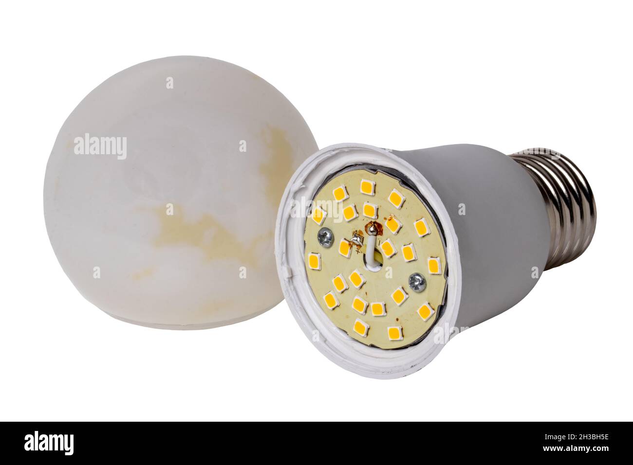 Defective bulbs. Close-up of an exploded led lamp with burn marks on ...