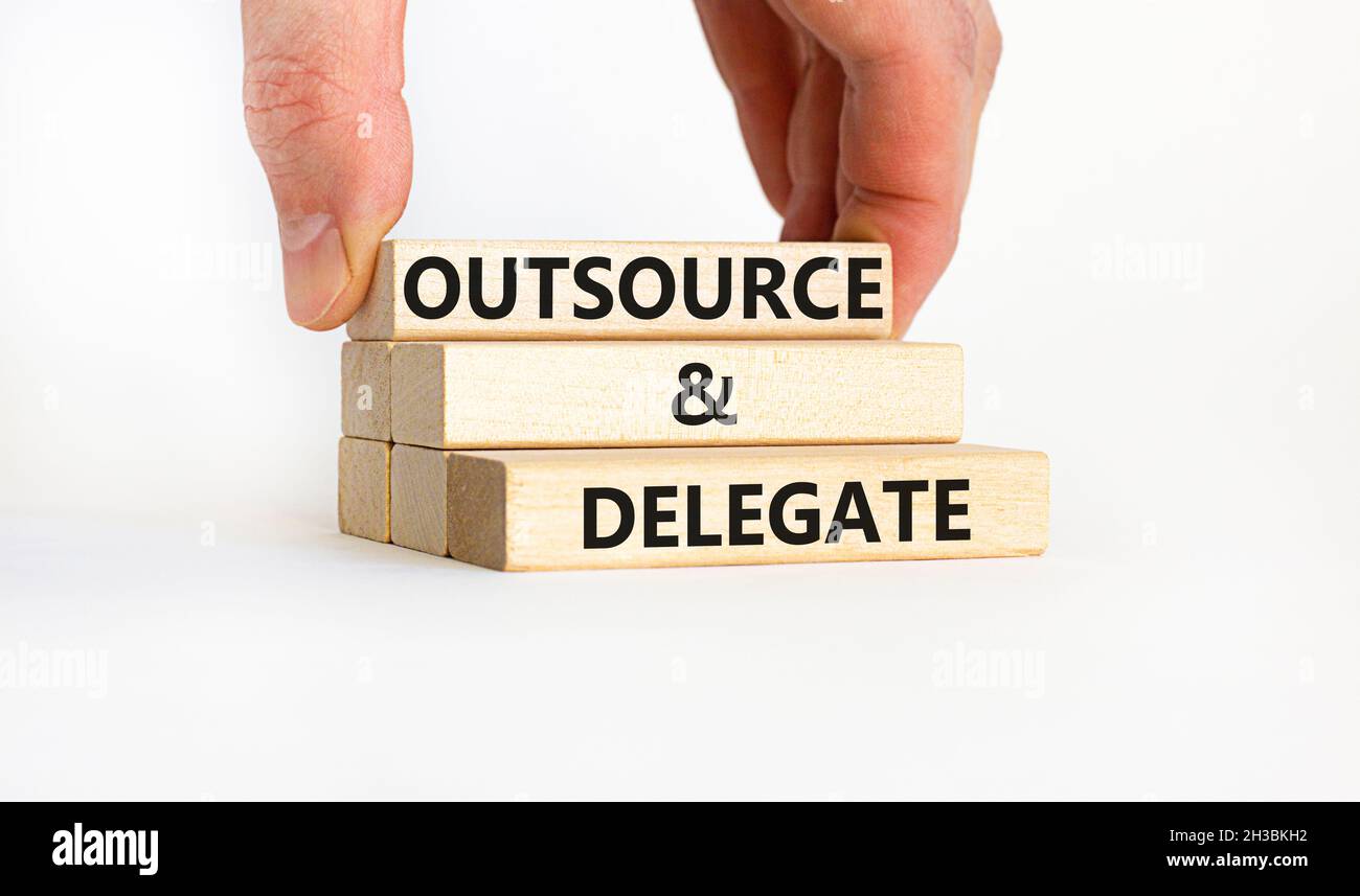 Outsource and delegate symbol. Concept words 'Outsource and delegate ...