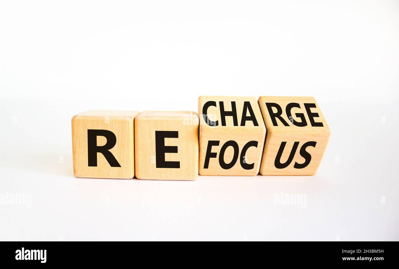 Refocus and recharge symbol. Businessman turned cubes and changed the ...