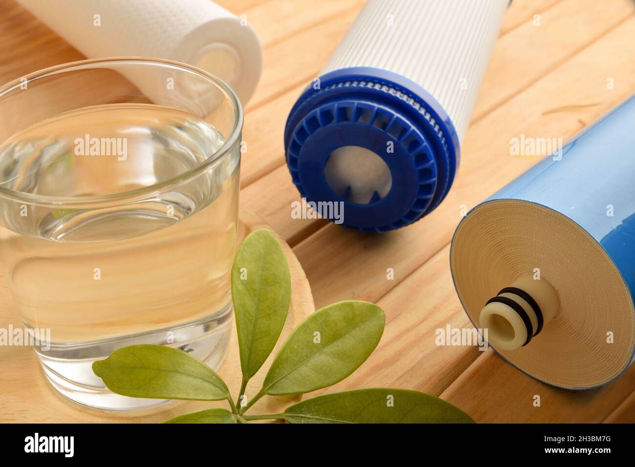 Glass of purified water with domestic environmentally friendly filters ...