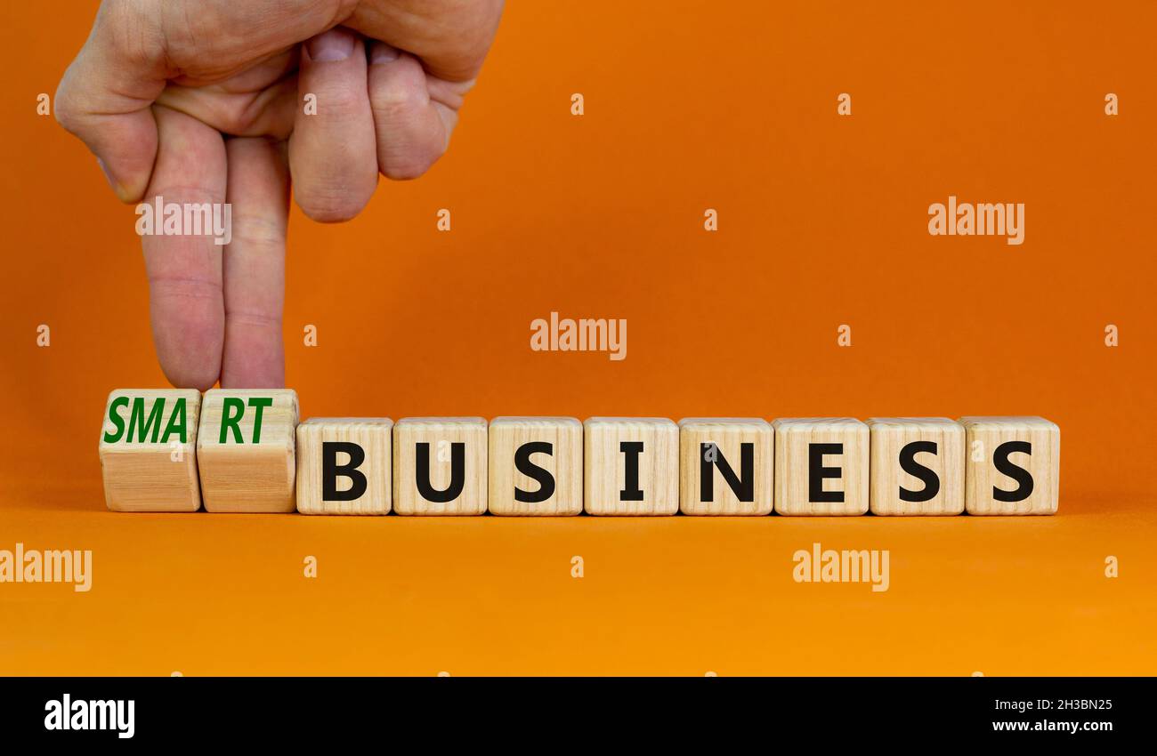 Time to smart business symbol. Wooden cubes with words 'Smart business ...