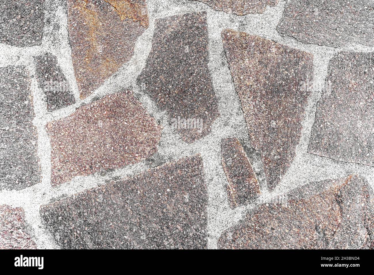 detail of the concrete wall structure - Small smooth colored stones ...