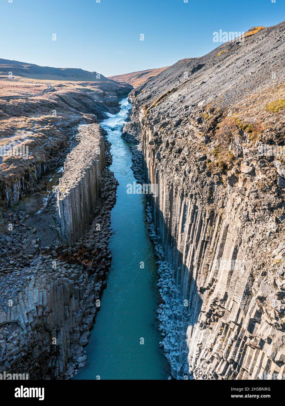 Studlagil canyon with turquoise water stream and basalt columns, Iceland Stock Photo - Alamy