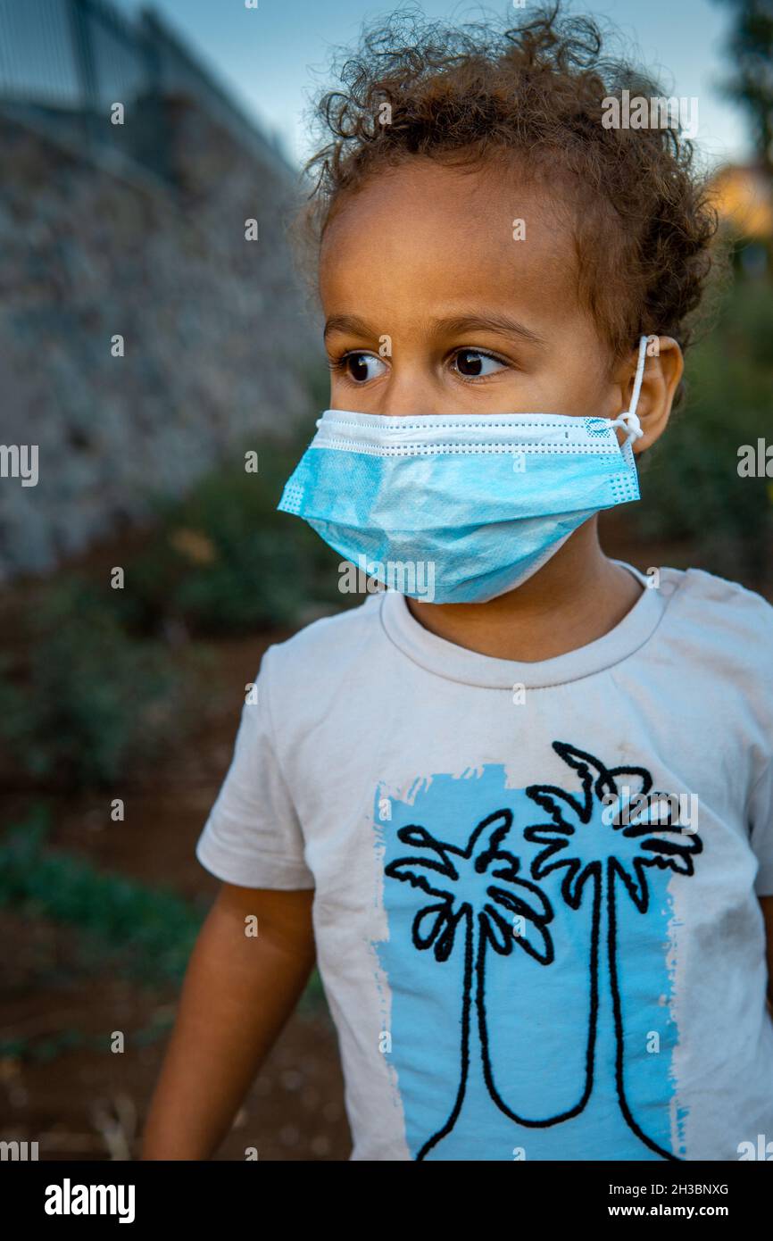 portrait of interracial ethiopian israeli toddler wearing a disposable ...