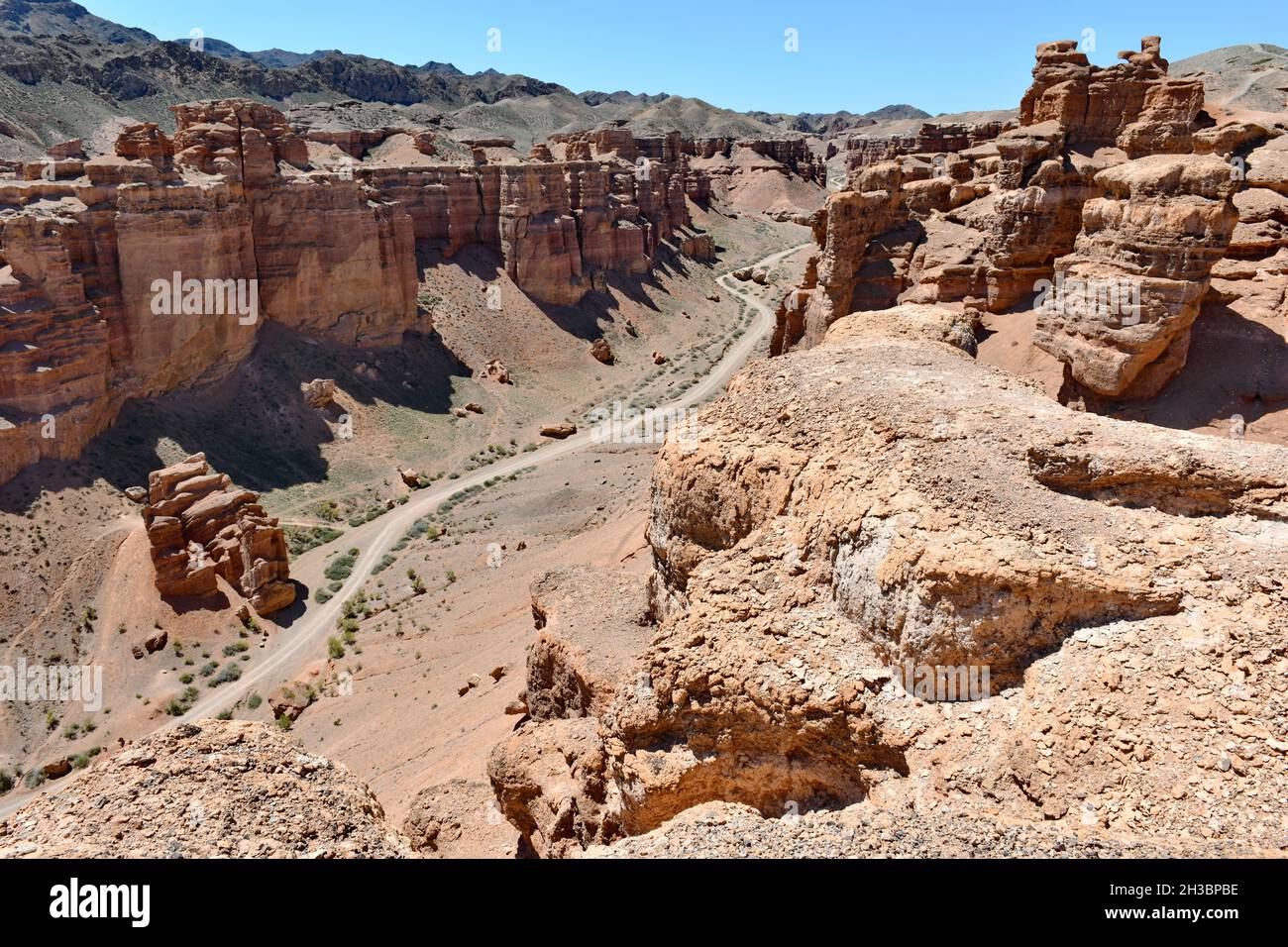 Canyon, panoramic sunlit view with rocks and road Stock Photo - Alamy
