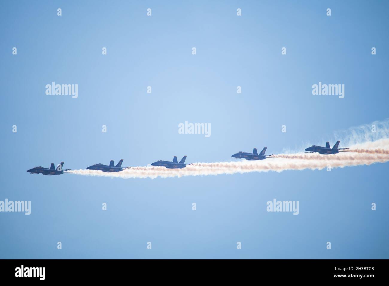 Beautiful shot of the view of five military planes making an airshow in ...