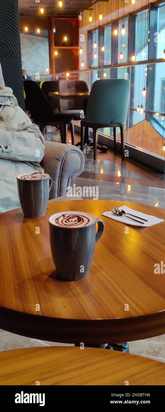 A photo of mugs on a table of a restaurant Stock Photo - Alamy