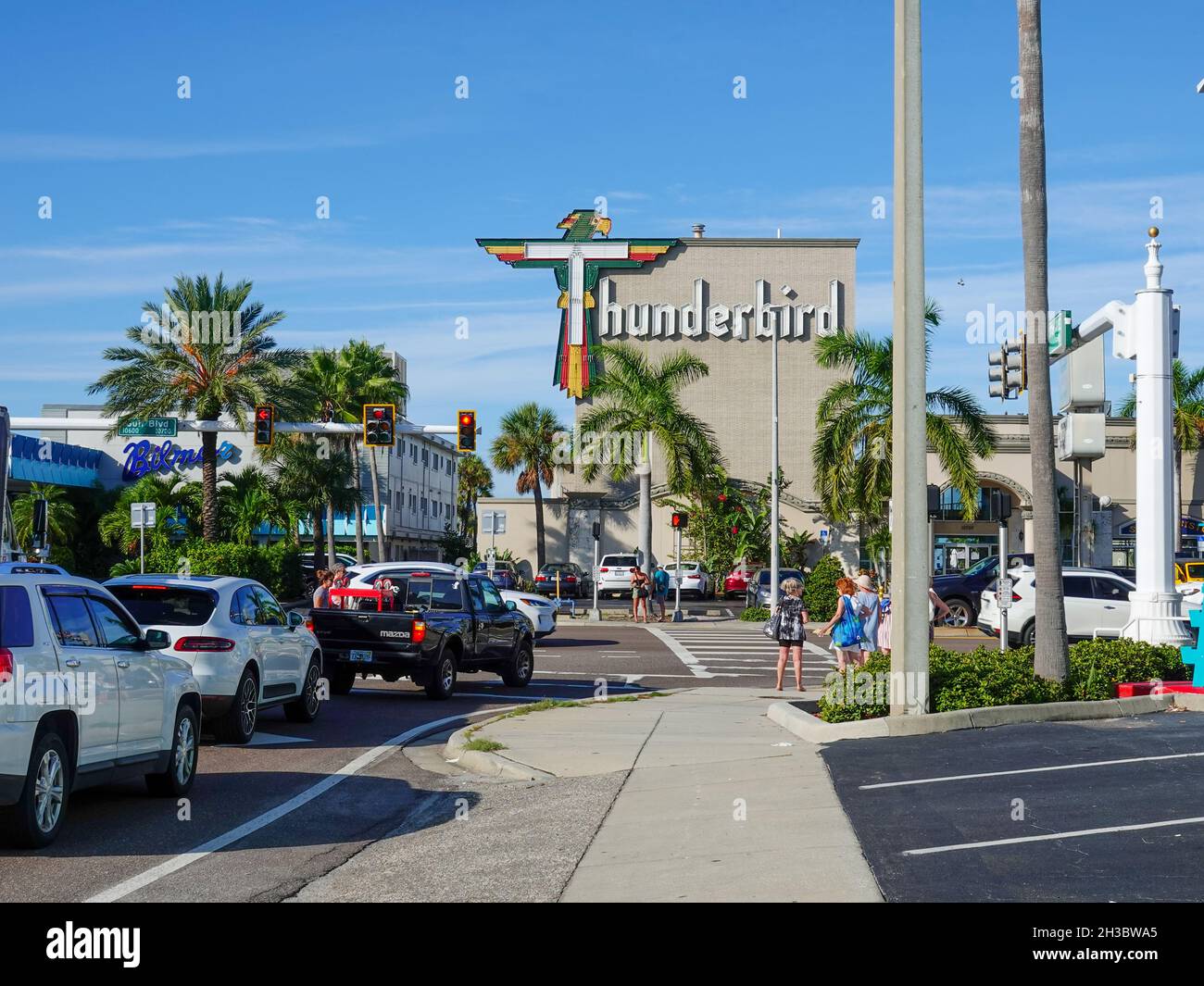 Traffic and pedestrians on busy Gulf Boulevard, in front of beach ...