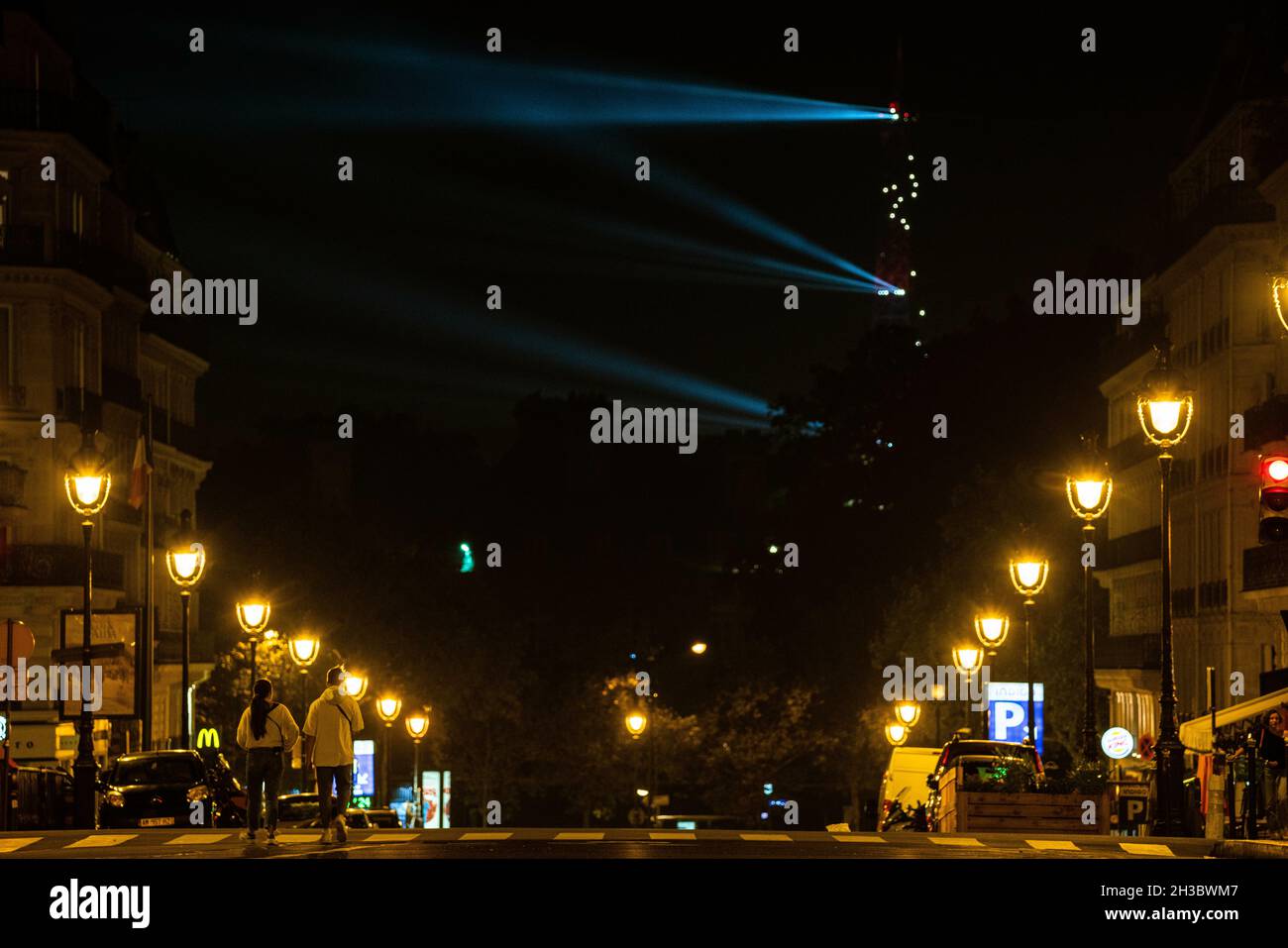Empty street in the downtown with turned on street lights during the ...