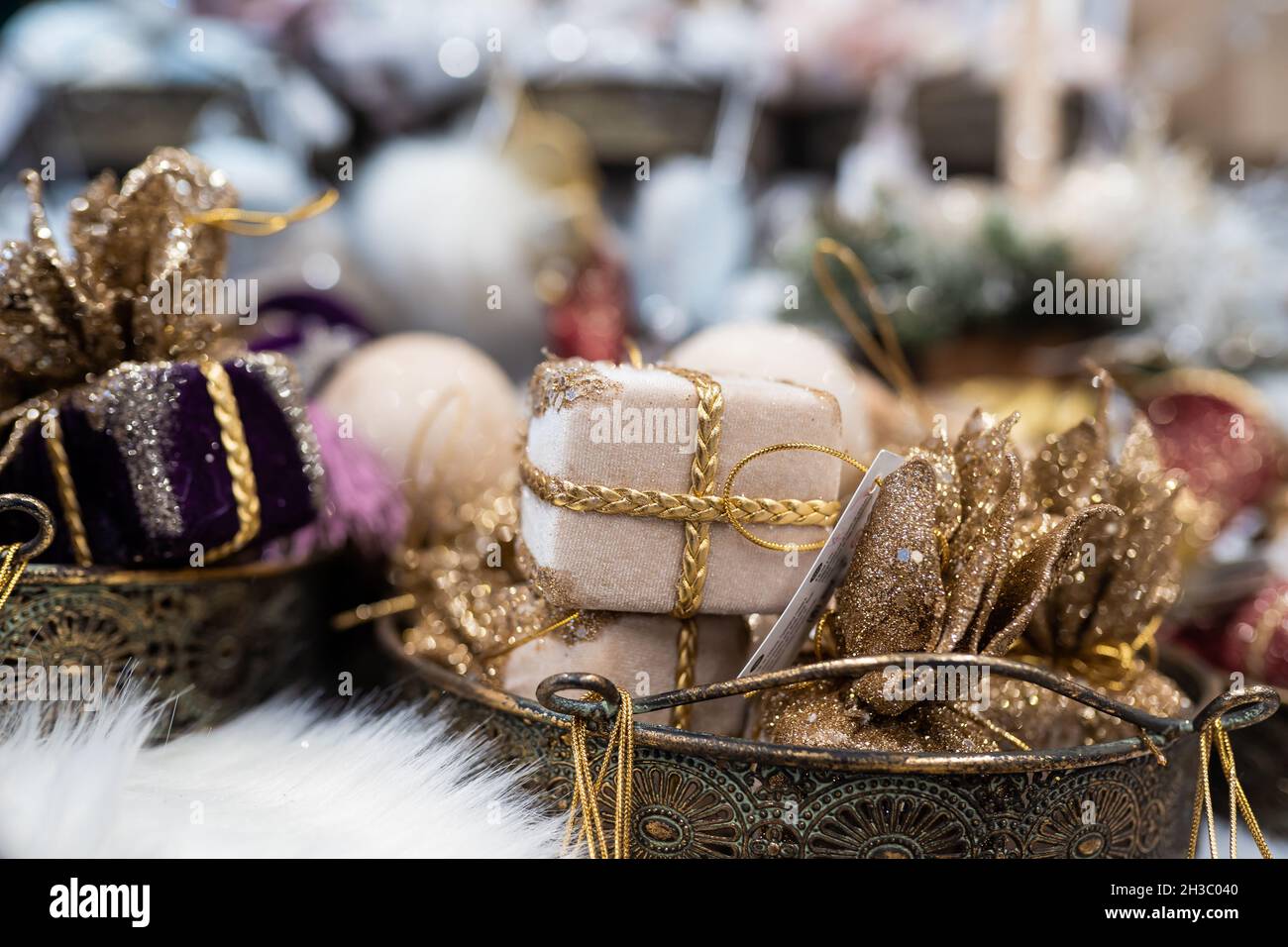 Different object toy gifts hanging from a decorated Christmas tree ...
