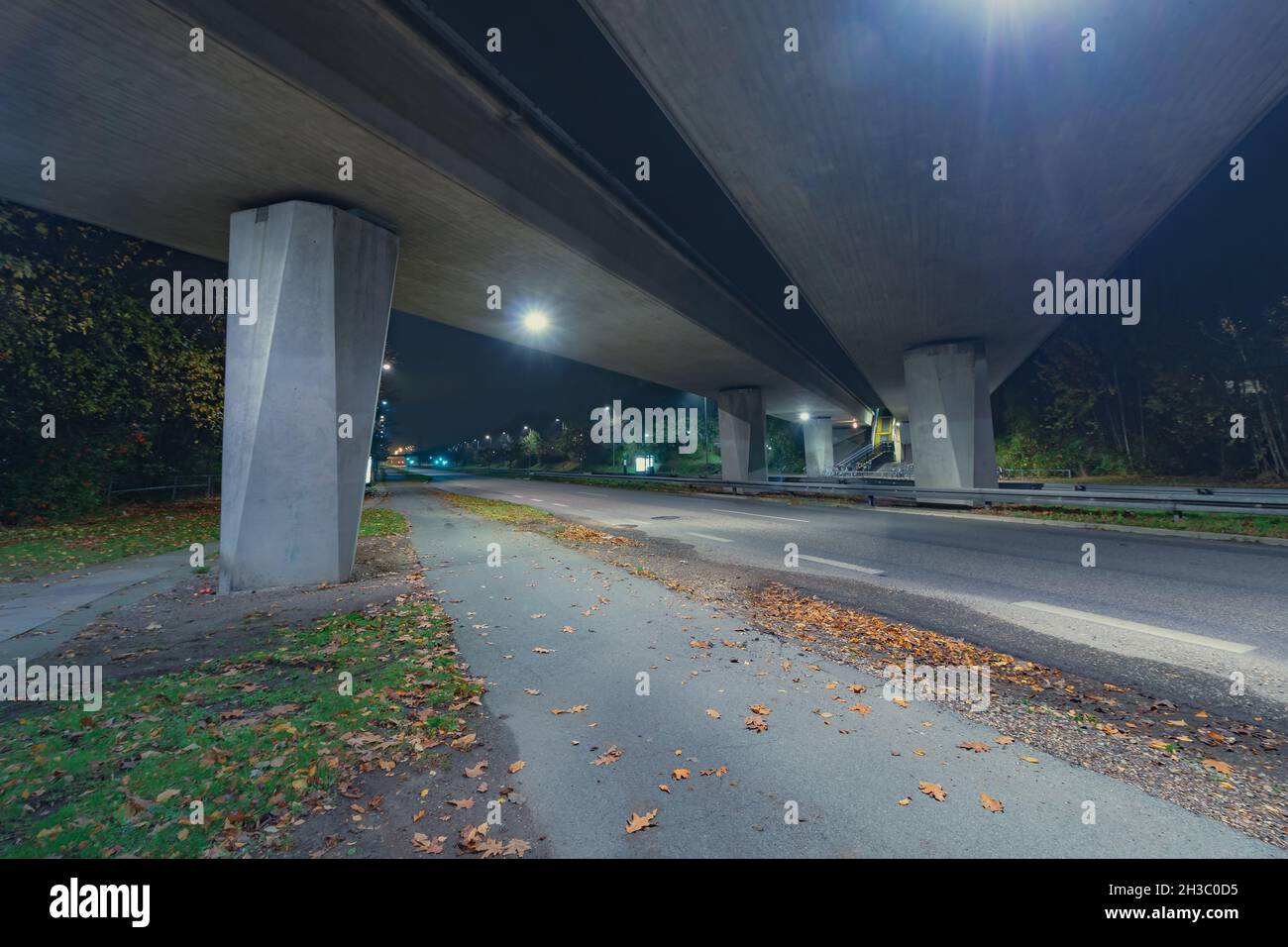 Vallensbaek strand station at night. Bridge over the road Stock Photo ...
