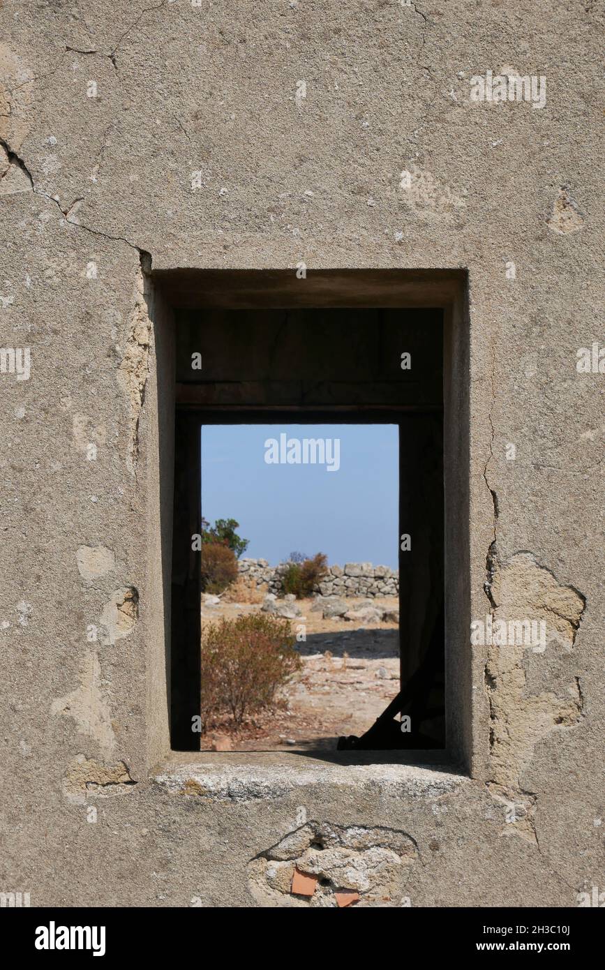 Vertical shot of a rectangle opening in a stone wall outdoors Stock ...