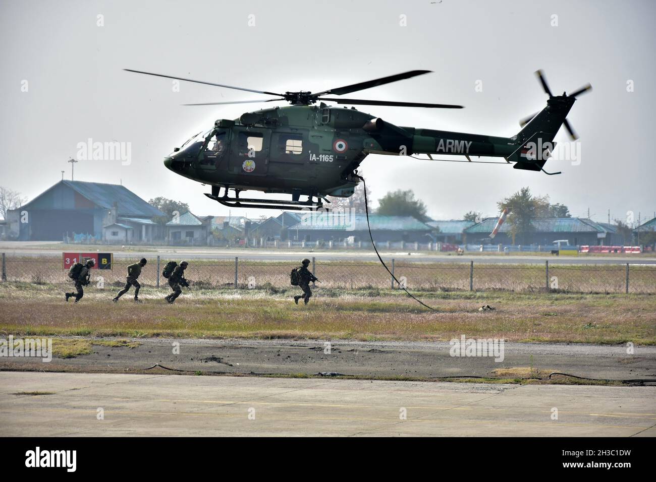 Indian paratroopers perform during a re-enactment of the Indian army's ...