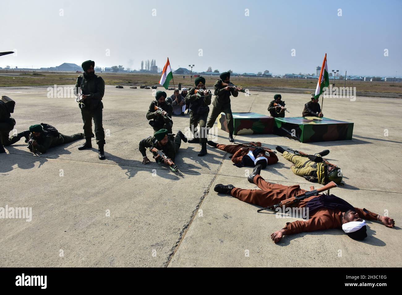 Indian army soldiers perform during a re-enactment of the Indian army's ...