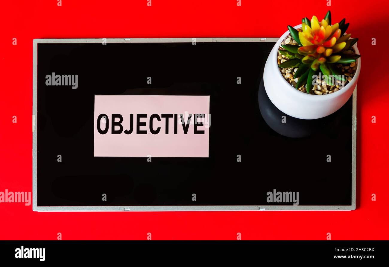The word is written OBJECTIVE on a sticker and a black background Stock ...