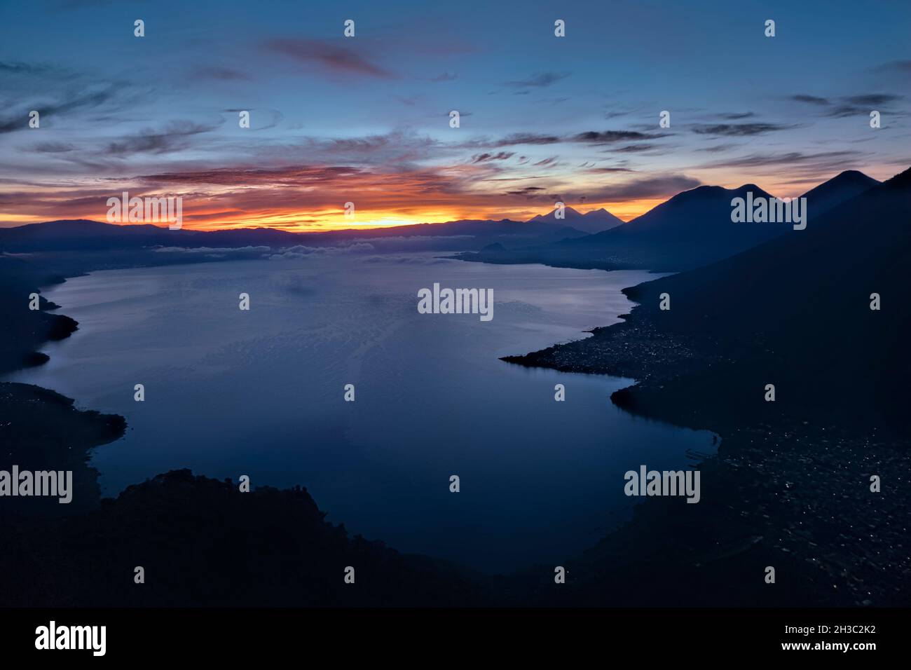 Sunrise over Lake Atitlan with Fuego, Acatenango, Toliman, and Atitlan ...