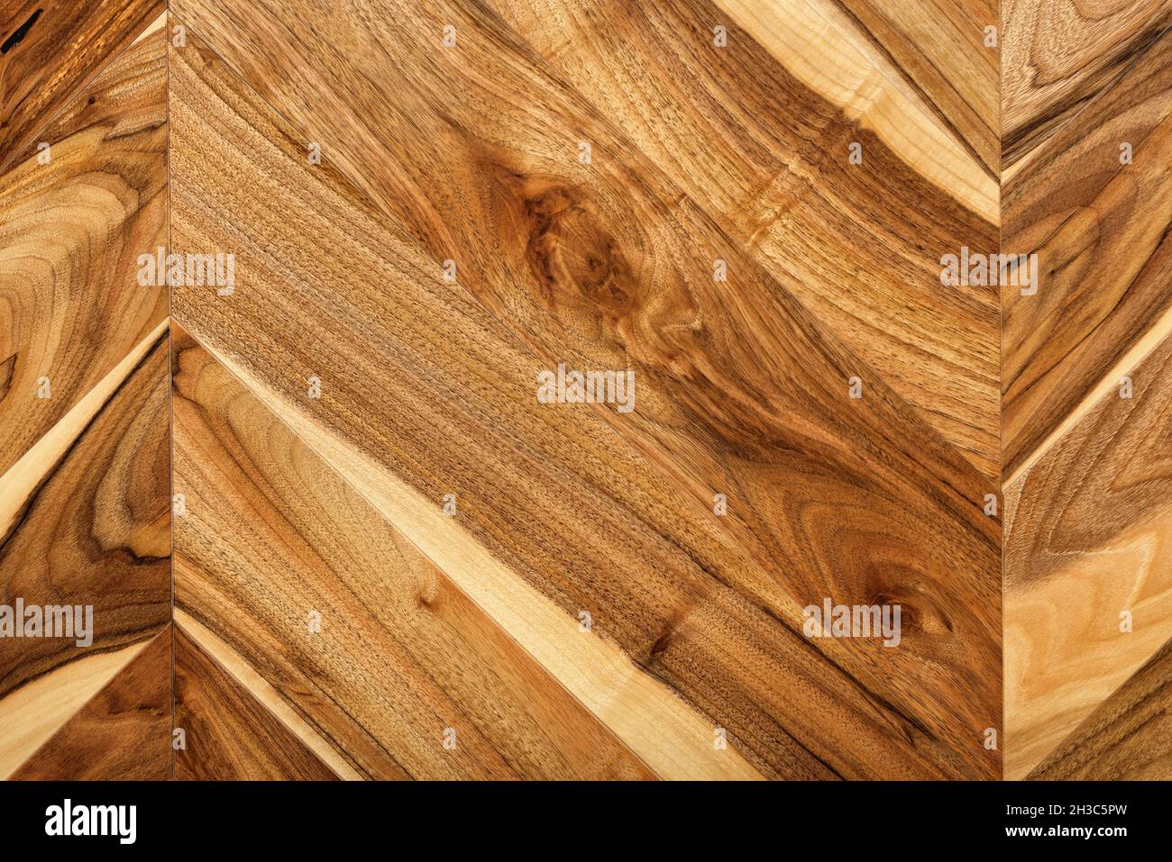 A beautiful pattern of European walnut wood as a smooth wooden surface ...