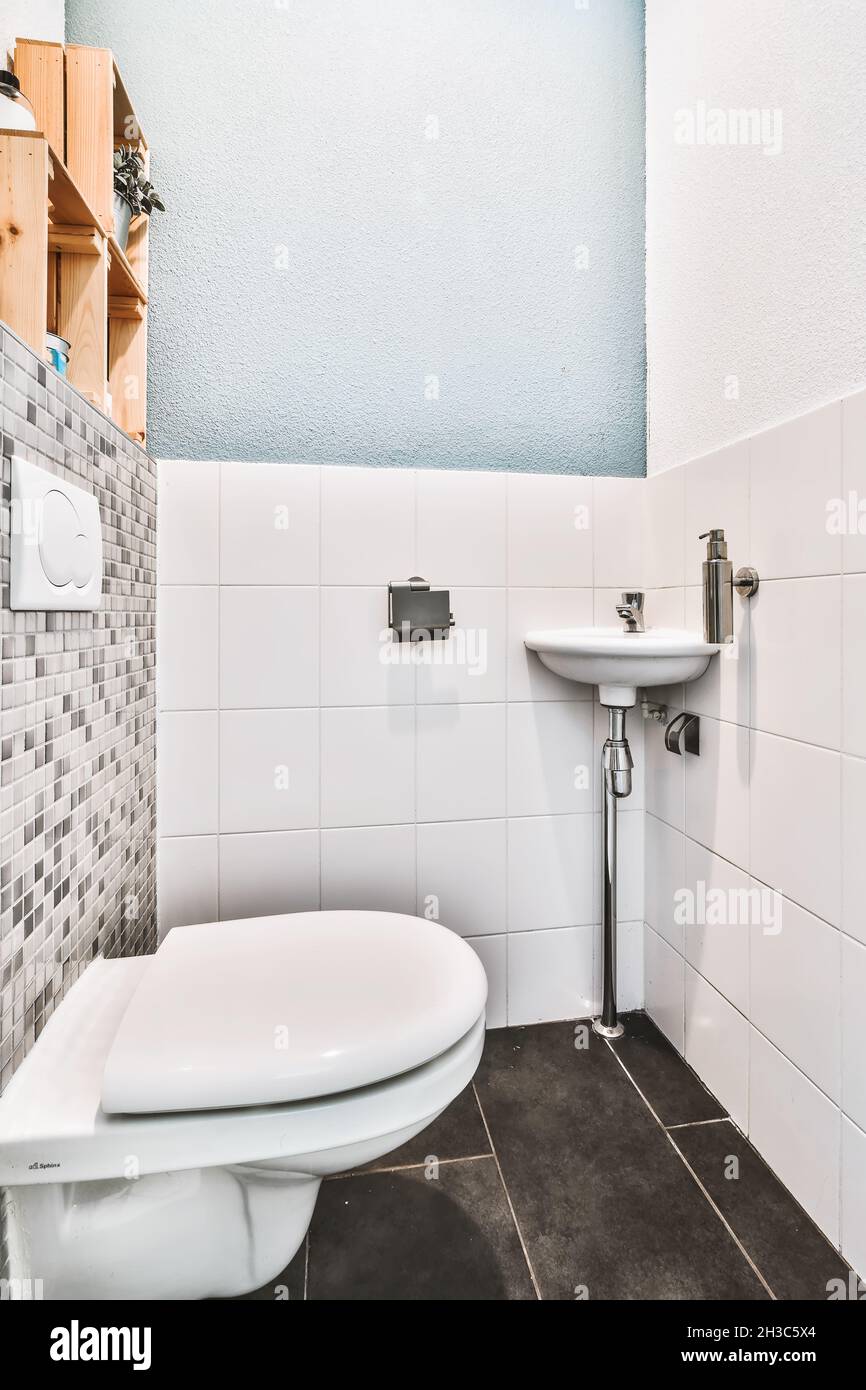 Interior of small clean restroom in miniature style Stock Photo - Alamy