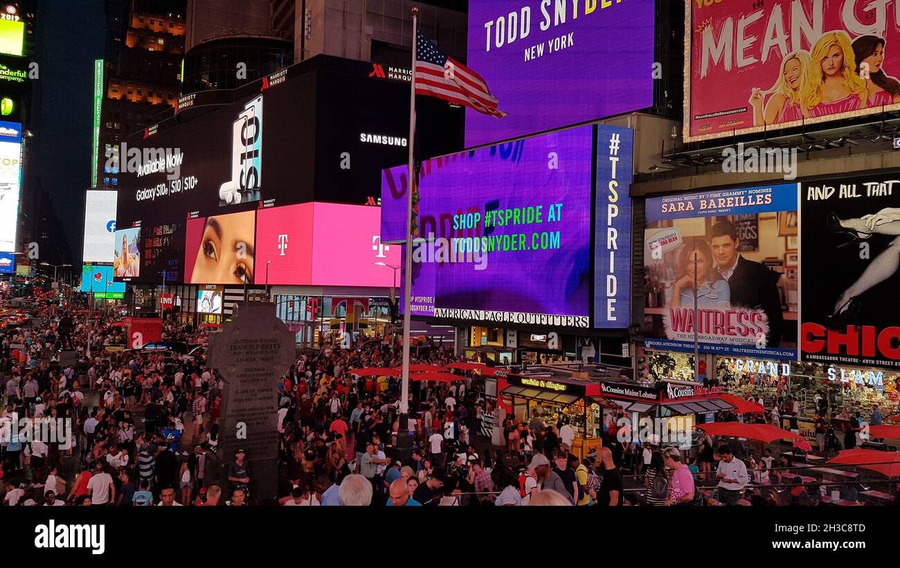 Crowded Times Square at night in New York, United States Stock Photo ...