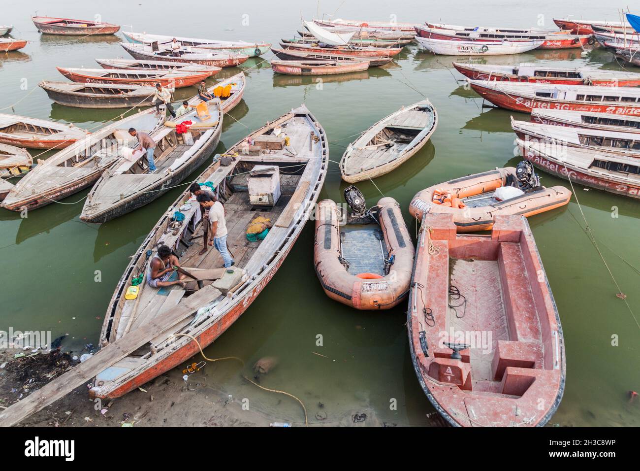 VARANASI, INDIA - OCTOBER 25, 2016: View of boats at sacred Ganges ...