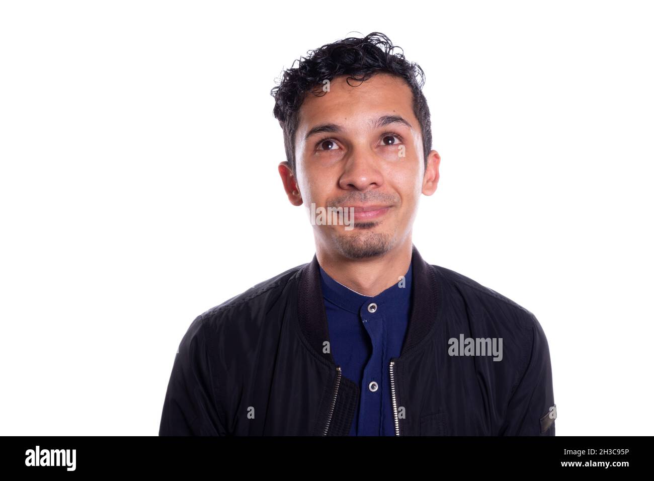 Man looking up while smiling, isolated on white background. Strange ...
