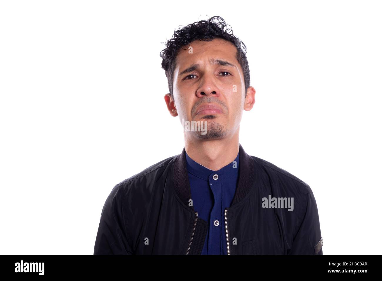 Man with sad face about to cry, isolated on white background. Latin ...