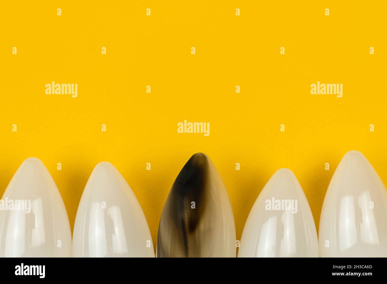 Destroyed LED light bulb after fire, electrical short circuit concept ...