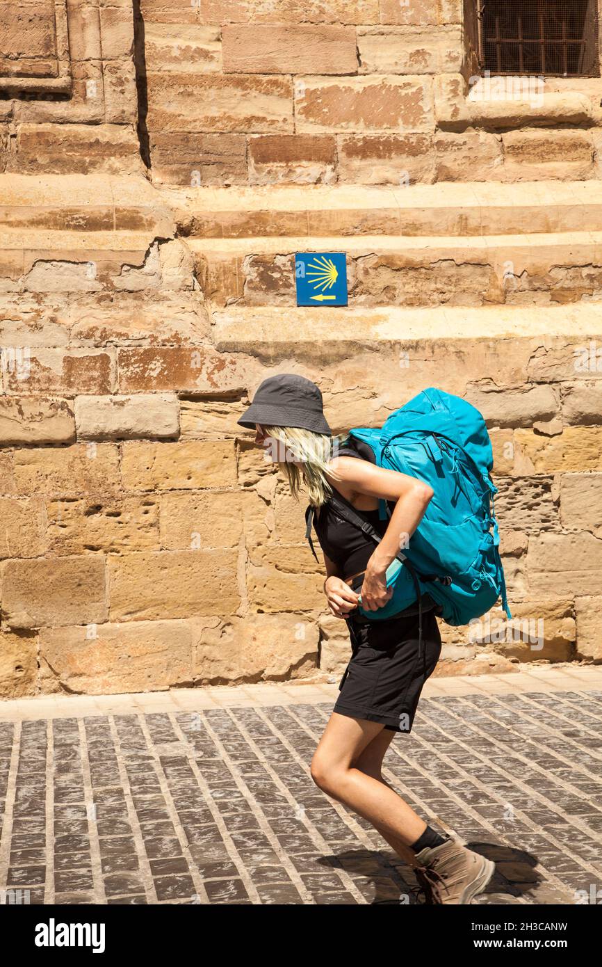 ,Pilgrims hiking through the Spanish town of Navarrete, La Rioja, while ...