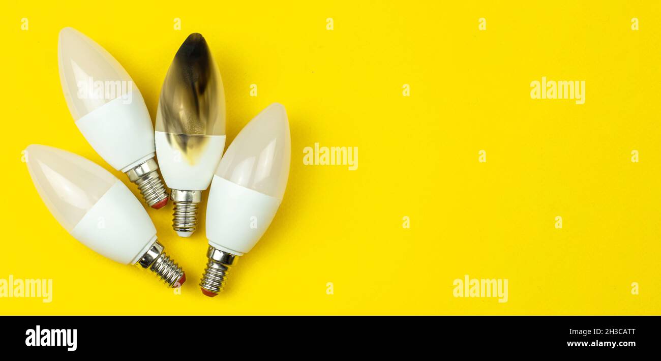 Broken and burn out LED light bulb after fire. Home safety concept. Top ...