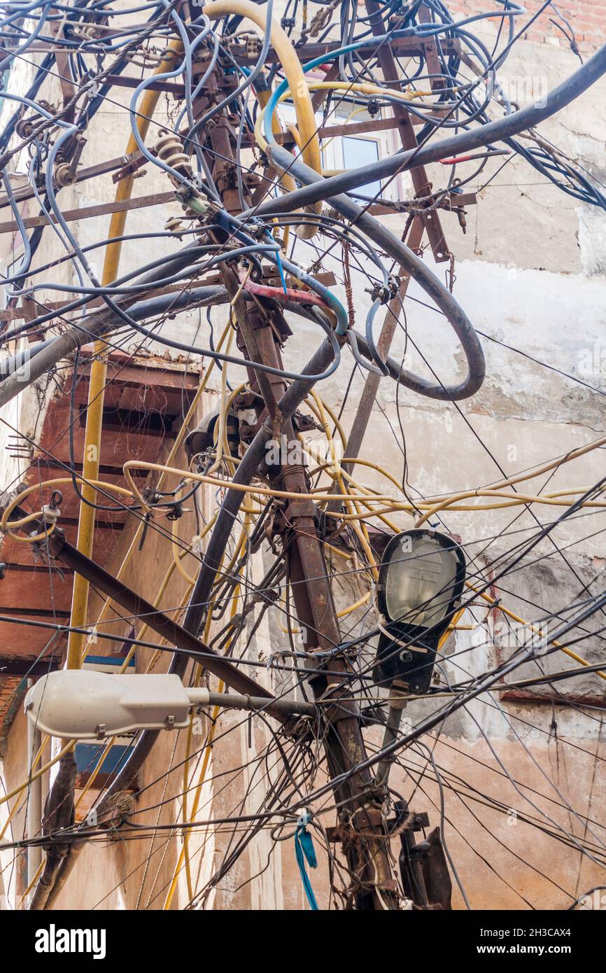 Chaotic mess of electric cables in the center of Delhi, India Stock ...
