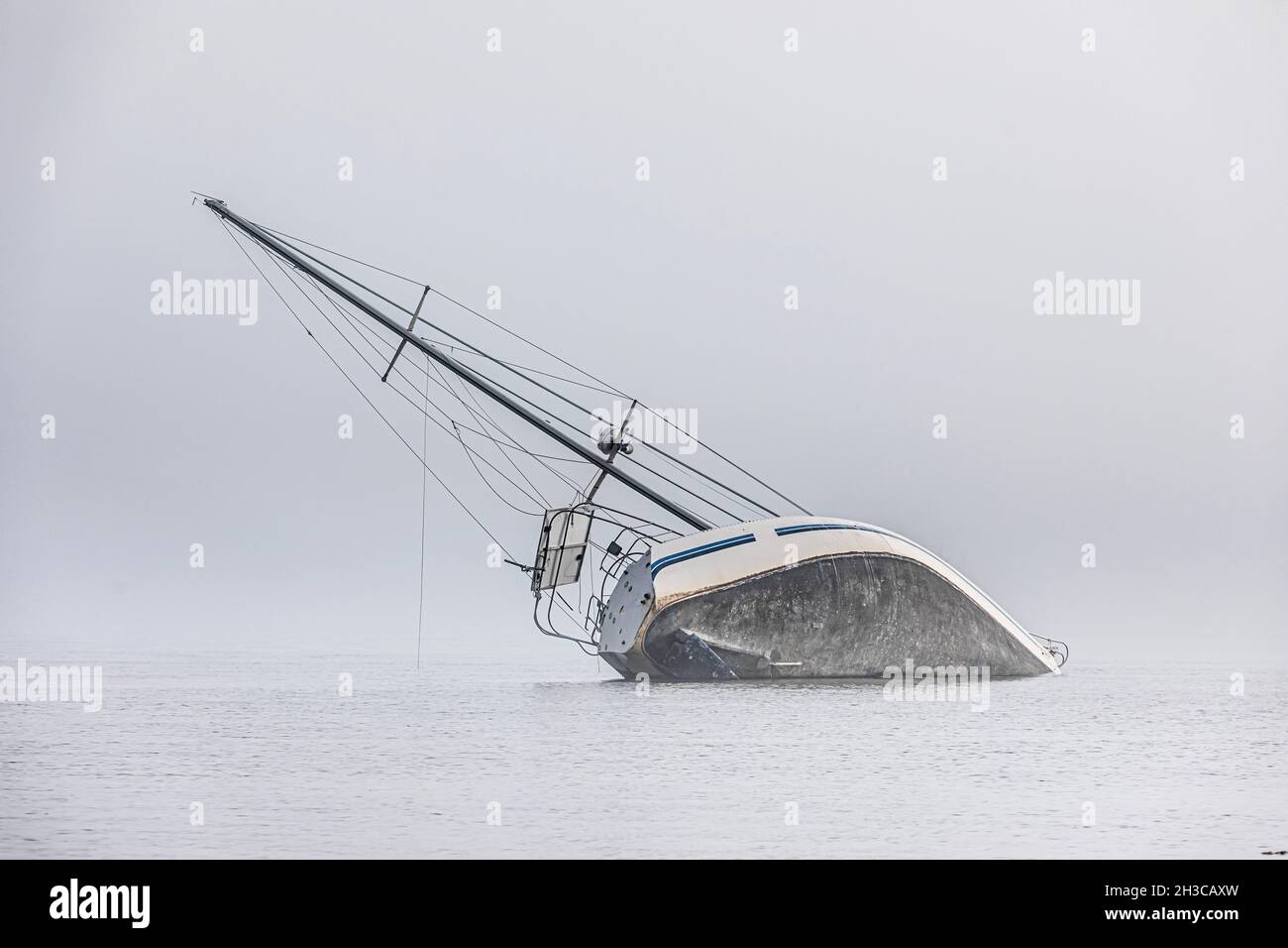 View of a sailboat accident in the ocean on a rainy day Stock Photo - Alamy