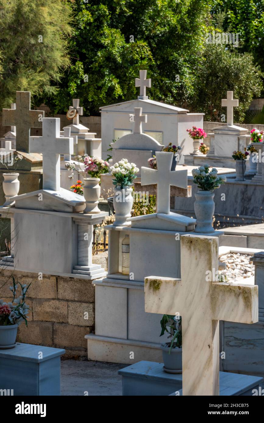 Gravestones and monumental stone masonry memorials in a churchyard on ...