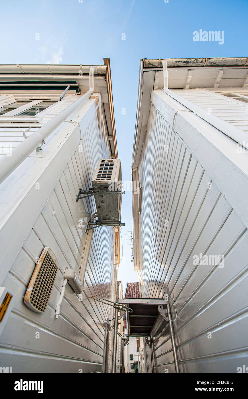 Small space between wooden houses Stock Photo - Alamy