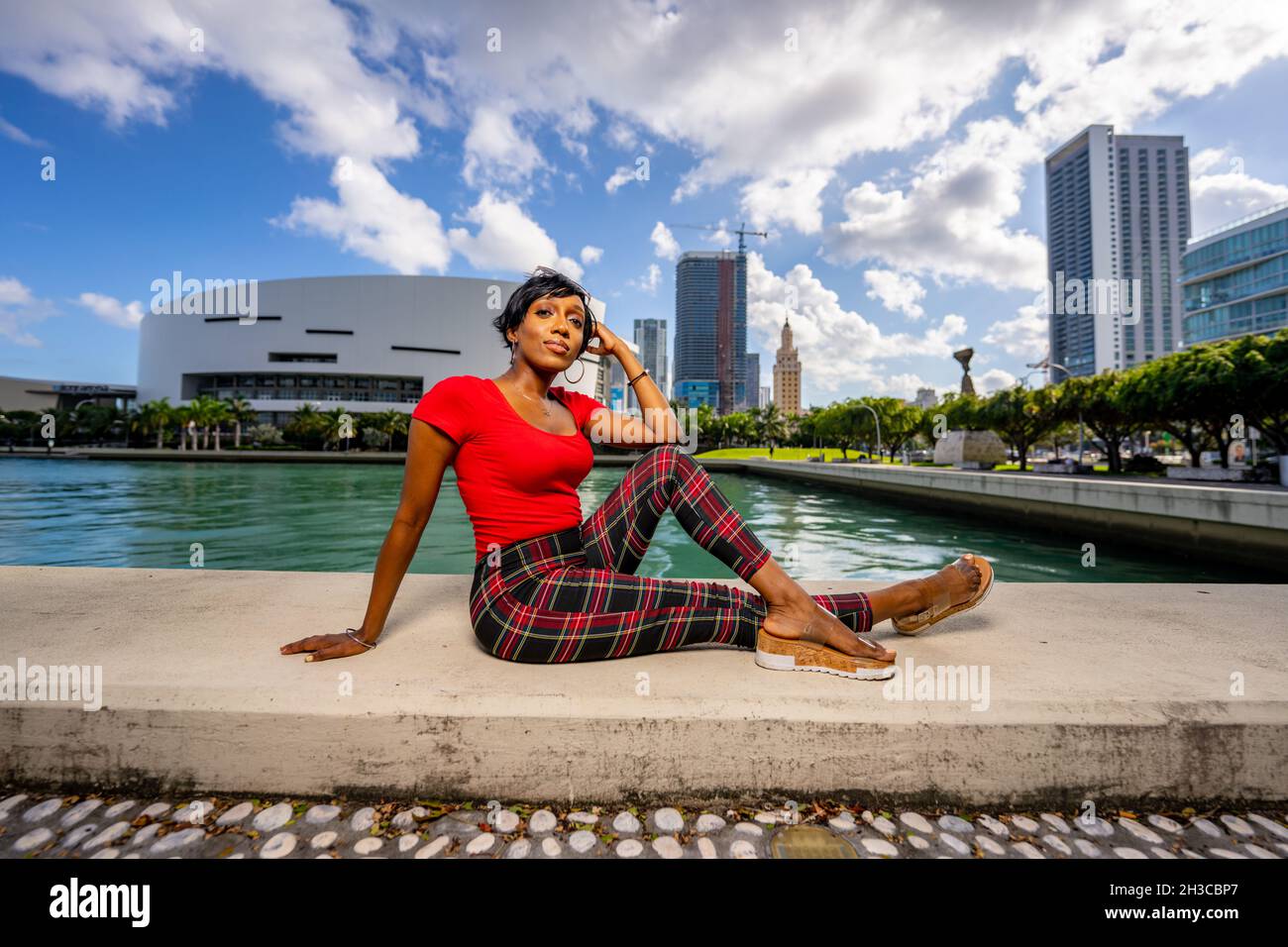 Photo of a beautiful female model posing outdoors in a park scene Stock ...