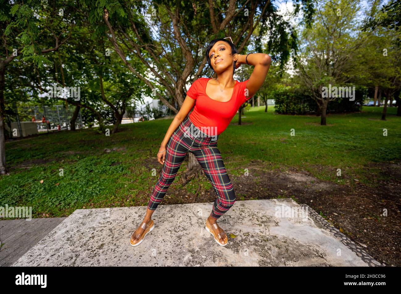 Photo of a beautiful female model posing outdoors in a park scene Stock ...