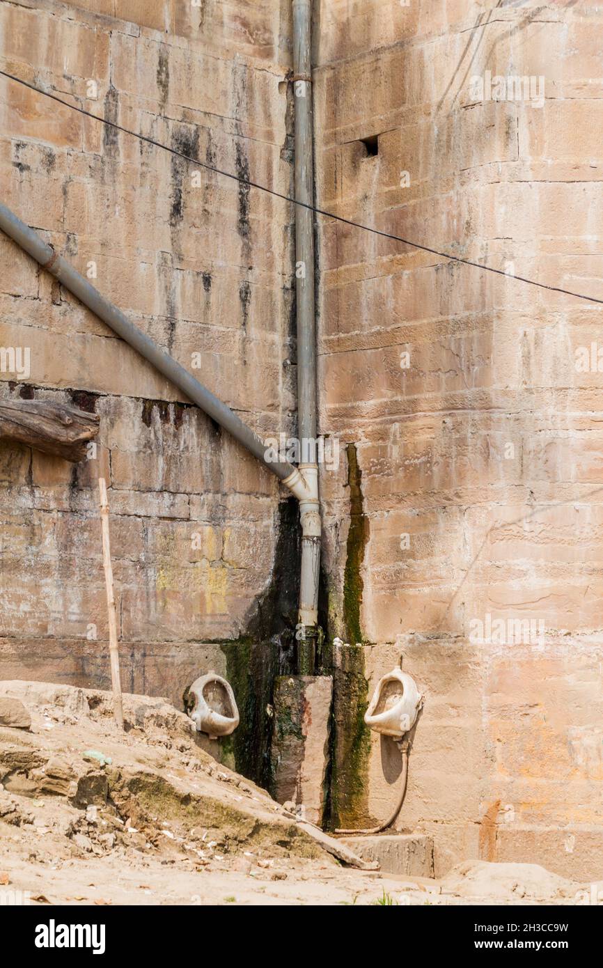 View of a Ghat riverfront steps with urinals, in Varanasi, India Stock ...