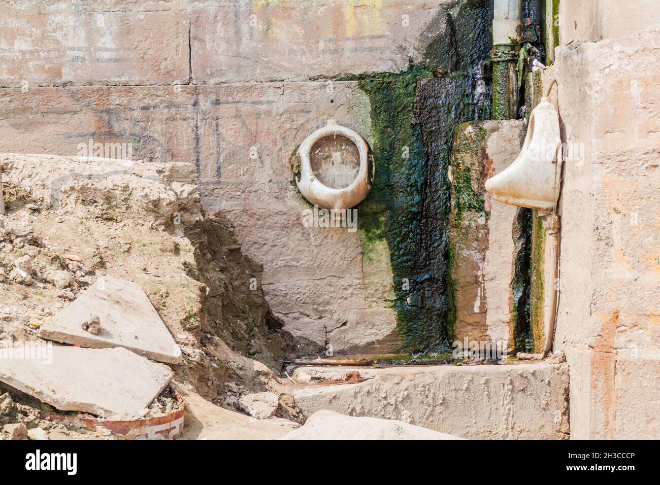 View of a Ghat riverfront steps with urinals, in Varanasi, India Stock ...