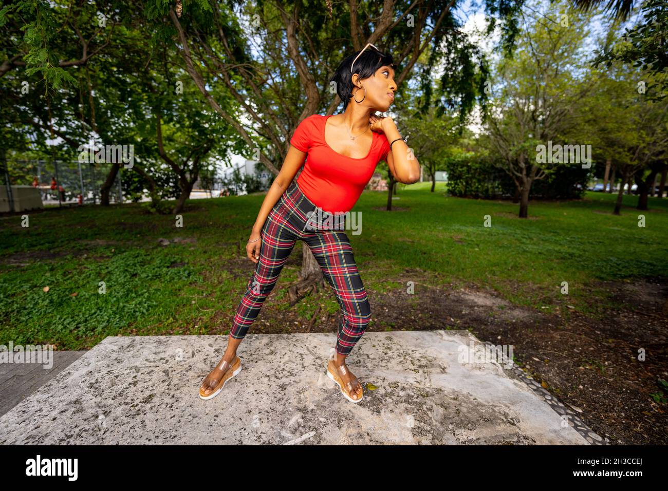 Photo of a beautiful female model posing outdoors in a park scene Stock ...
