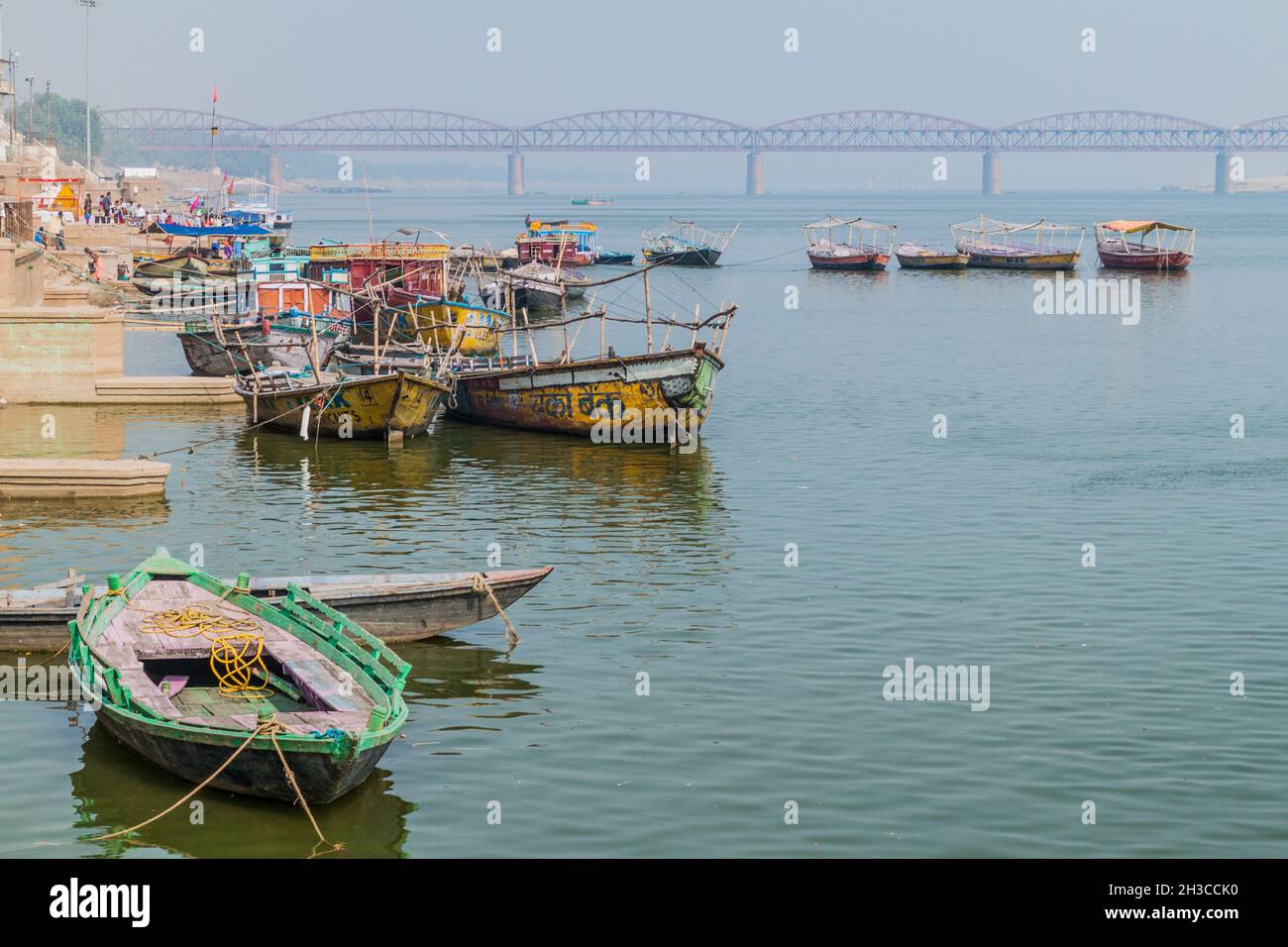 VARANASI, INDIA - OCTOBER 25, 2016: Wooden boats at sacred river Ganges ...