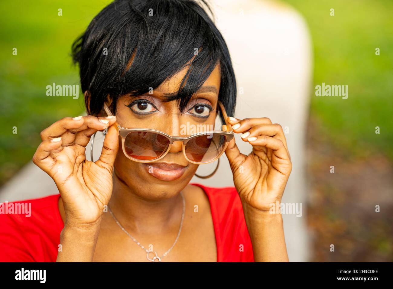 Photo of a beautiful female model posing outdoors in a park scene Stock ...